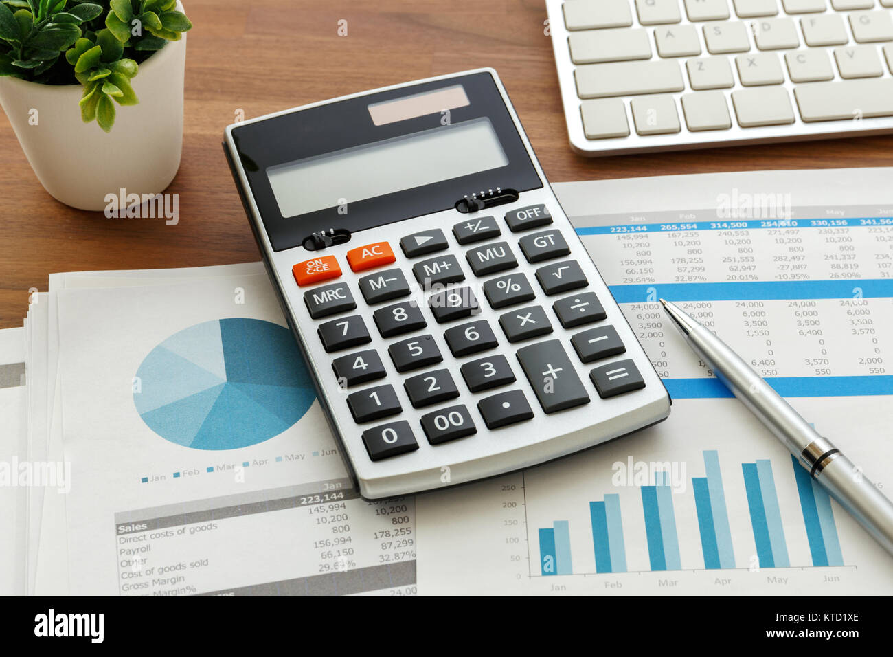 Financial accounting with calculator and financial chart data and ...