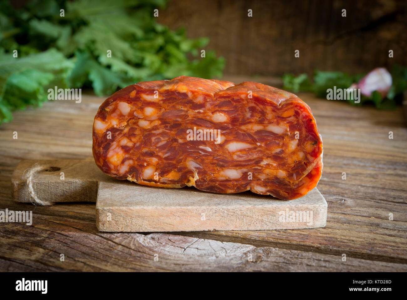Typical Calabrian italian salami called spianata on wooden table Stock ...