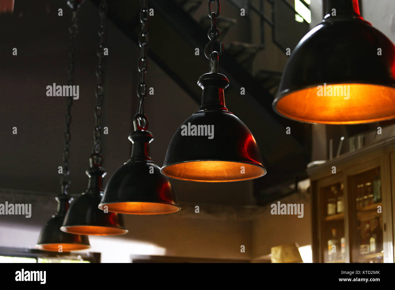 lamps hanging from ceiling over the counter bar Stock Photo - Alamy