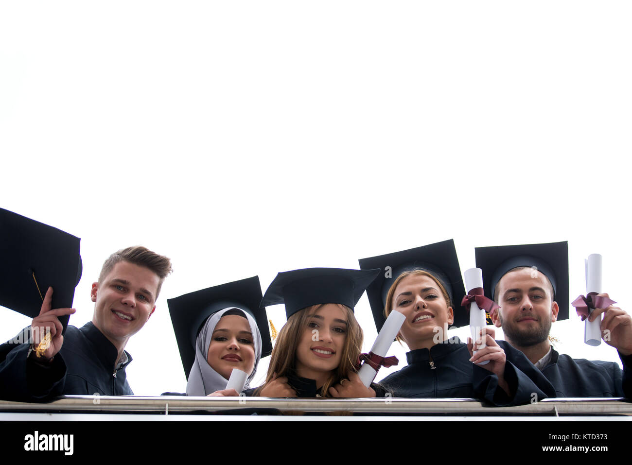 Young people graduating, celebration Stock Photo - Alamy