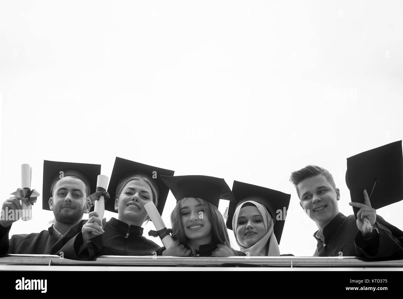 Young people graduating, celebration Stock Photo - Alamy