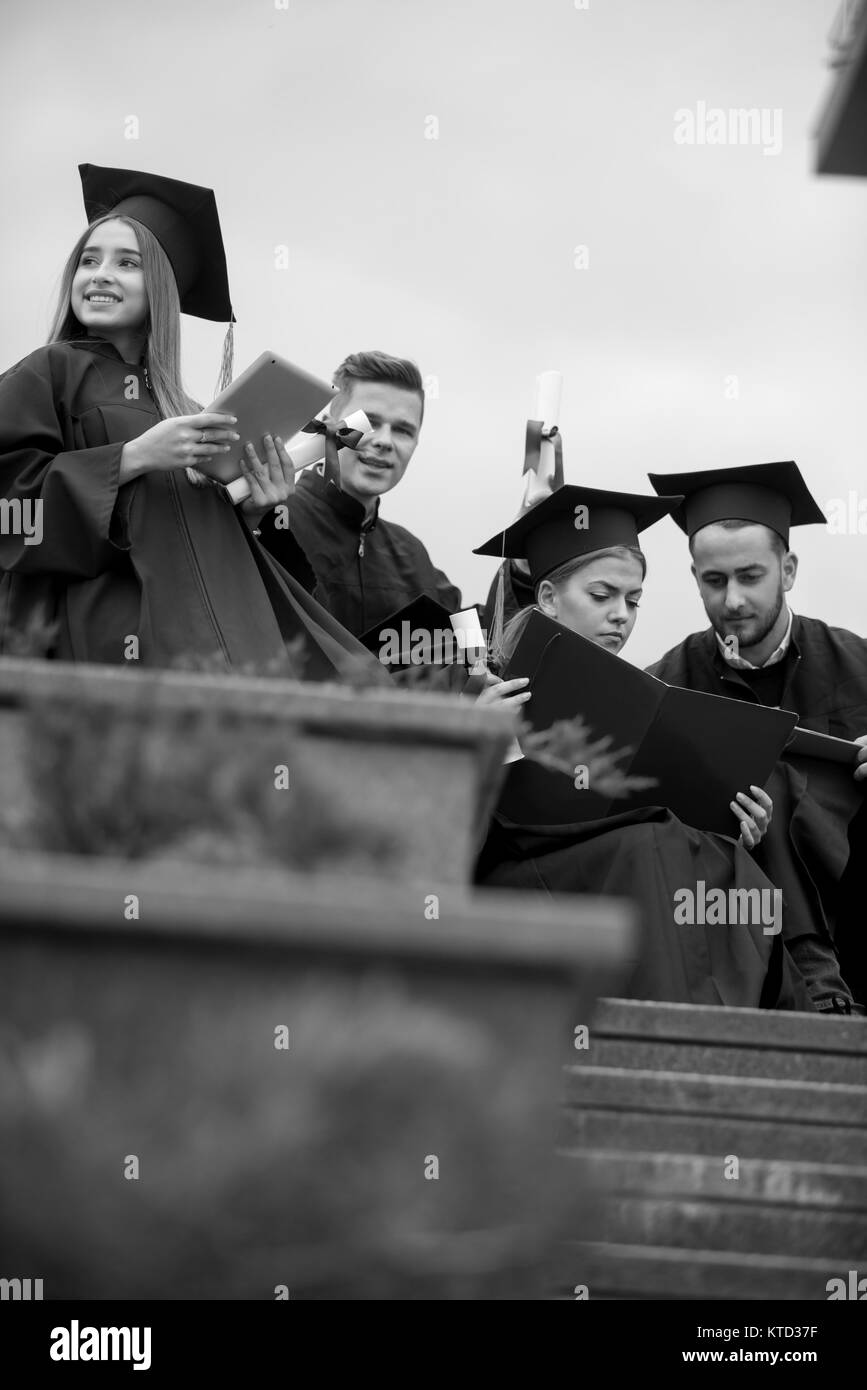 Young people graduating, celebration Stock Photo - Alamy
