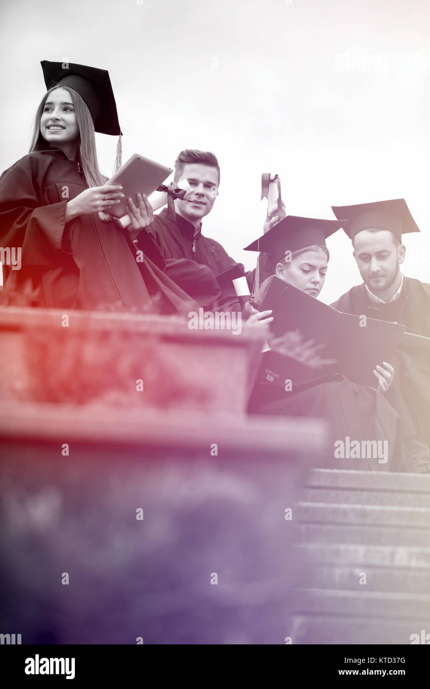 Young people graduating, celebration Stock Photo - Alamy
