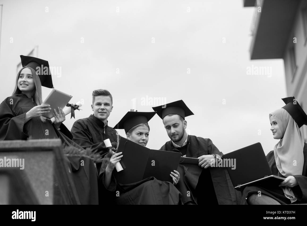 Young people graduating, celebration Stock Photo - Alamy