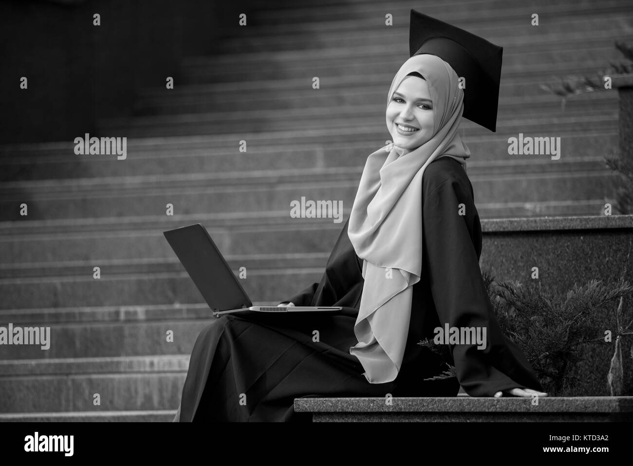 Pretty young female graduate wearing hijab Stock Photo - Alamy