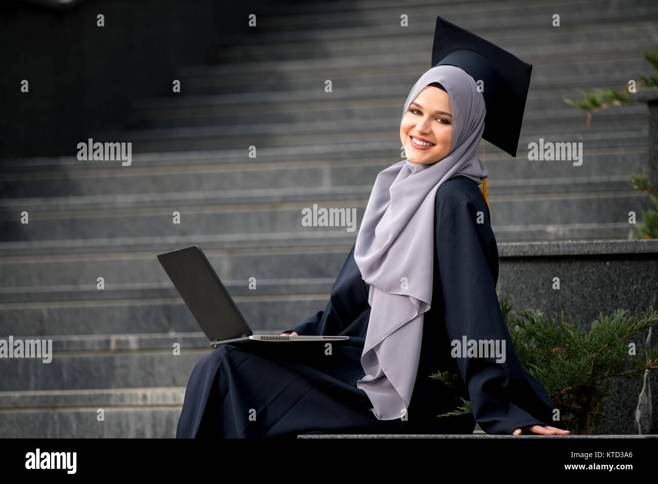 Pretty young female graduate wearing hijab Stock Photo - Alamy