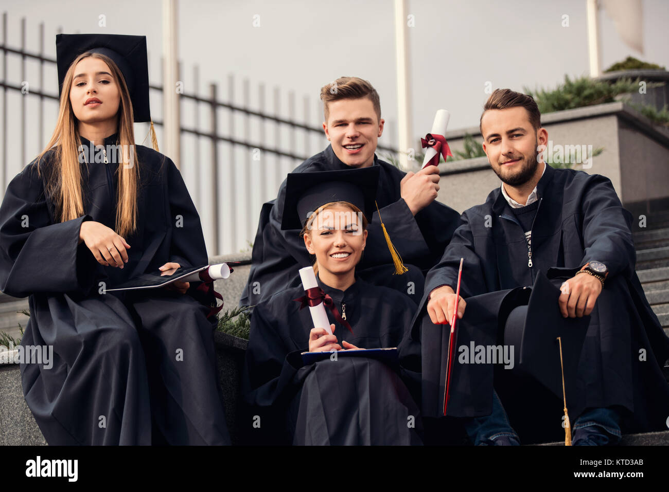 Young people graduating, celebration Stock Photo - Alamy