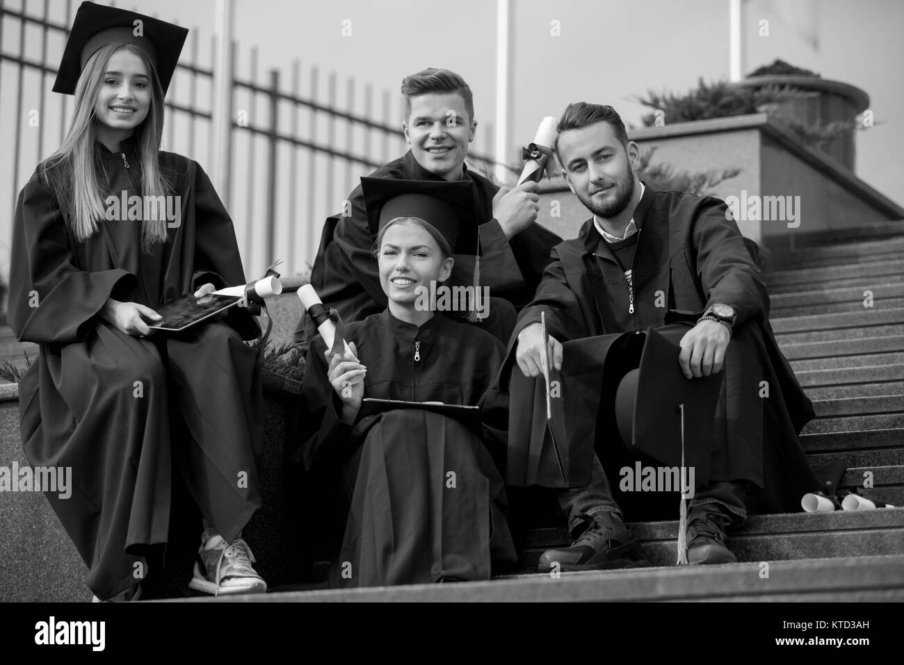 Young people graduating, celebration Stock Photo - Alamy