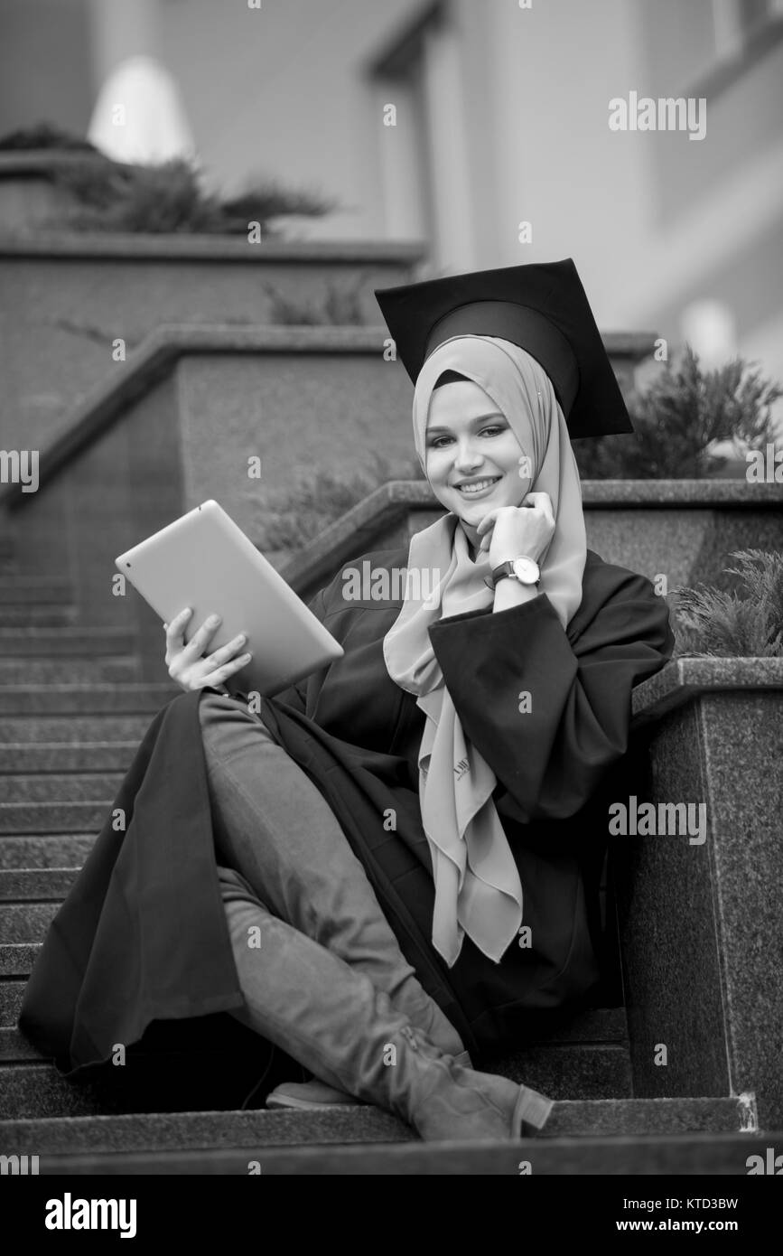 Pretty young female graduate wearing hijab Stock Photo - Alamy