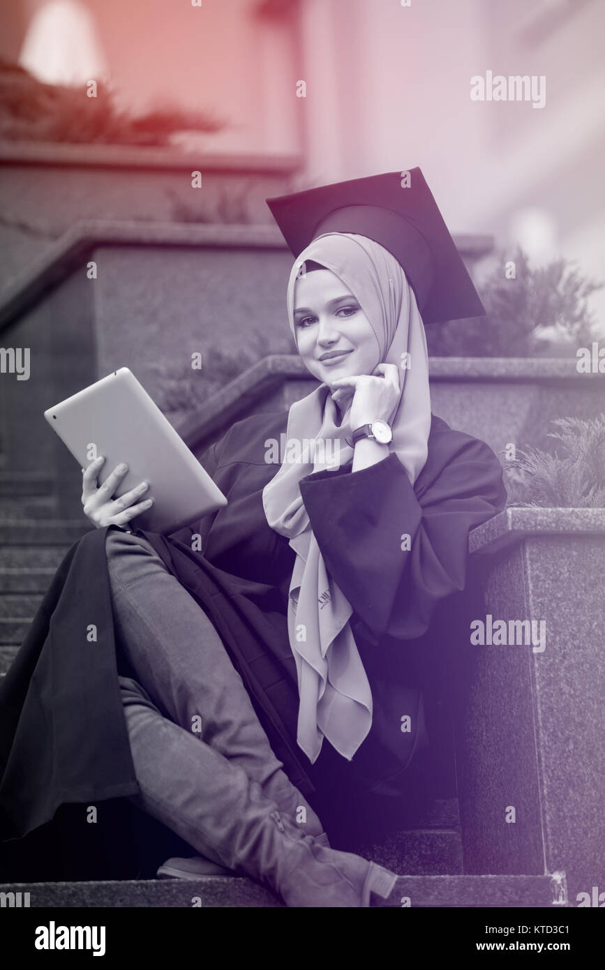 Pretty young female graduate wearing hijab Stock Photo - Alamy
