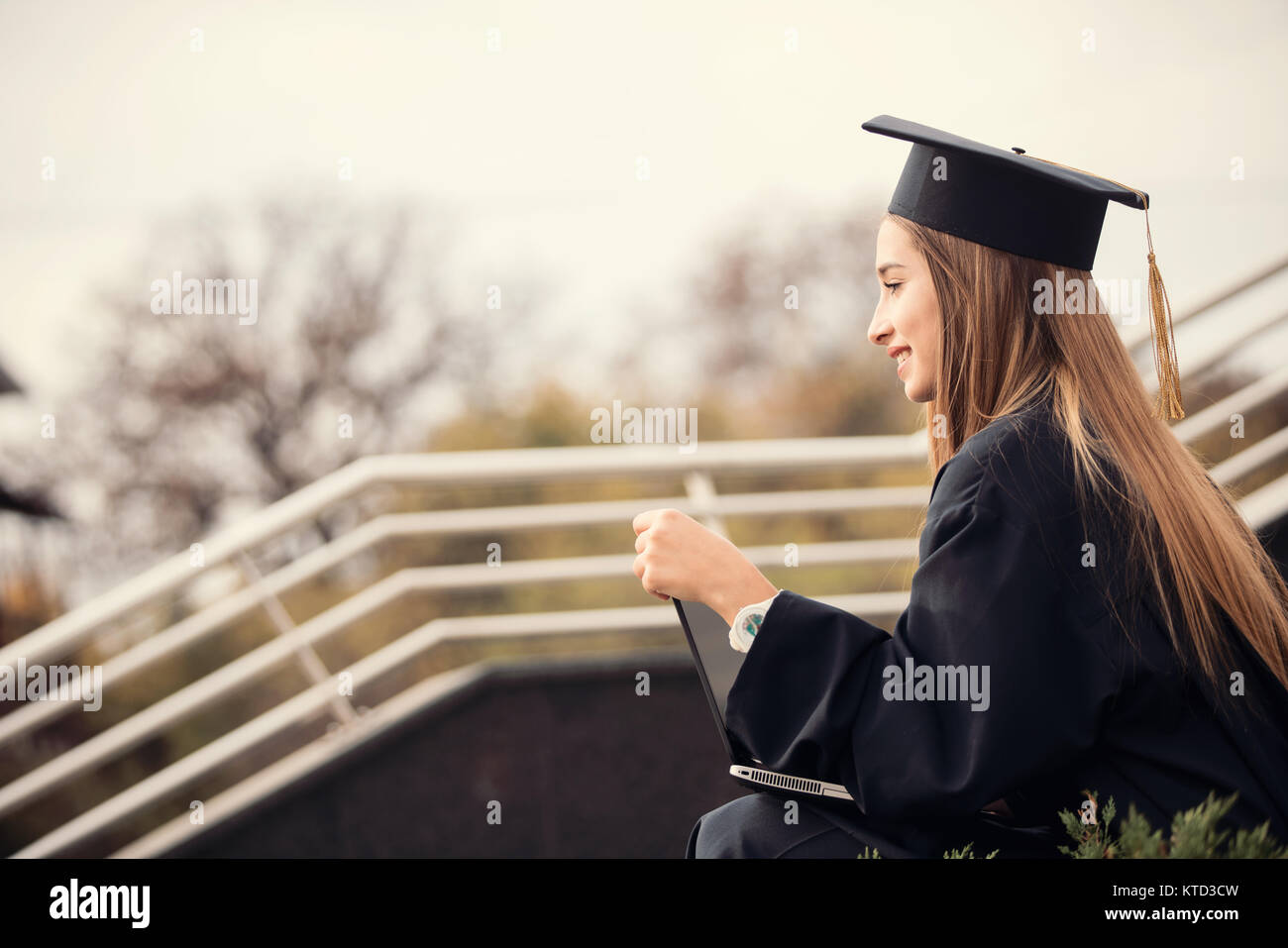 Pretty young girl, graduation day pose, diploma Stock Photo - Alamy