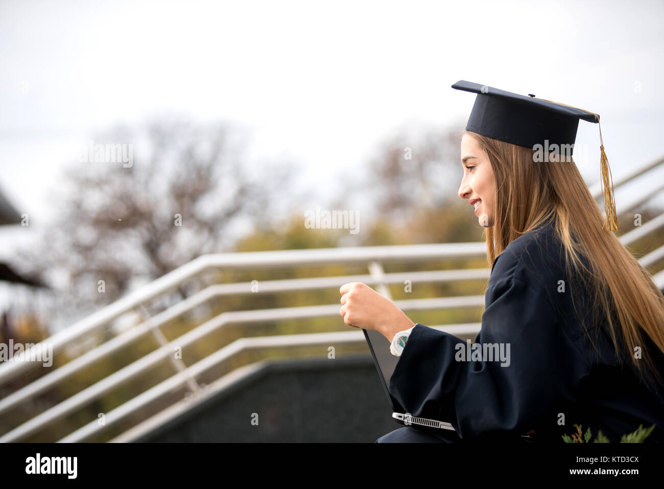 Pretty young girl, graduation day pose, diploma Stock Photo - Alamy
