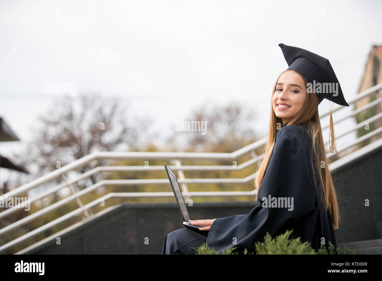 Pretty young girl, graduation day pose, diploma Stock Photo - Alamy