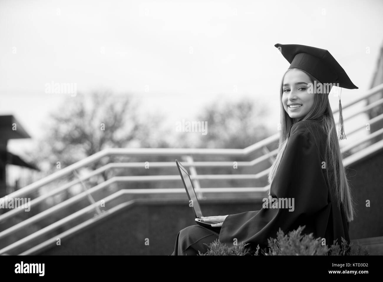 Pretty young girl, graduation day pose, diploma Stock Photo - Alamy