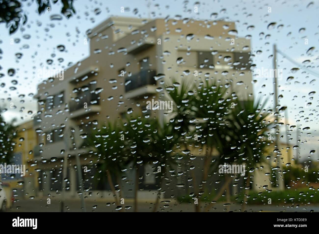 Water drops in windshield of car with building of bottom Stock Photo ...