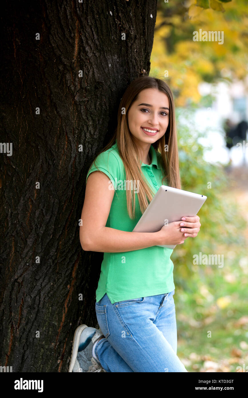 Girl using tablet Stock Photo - Alamy