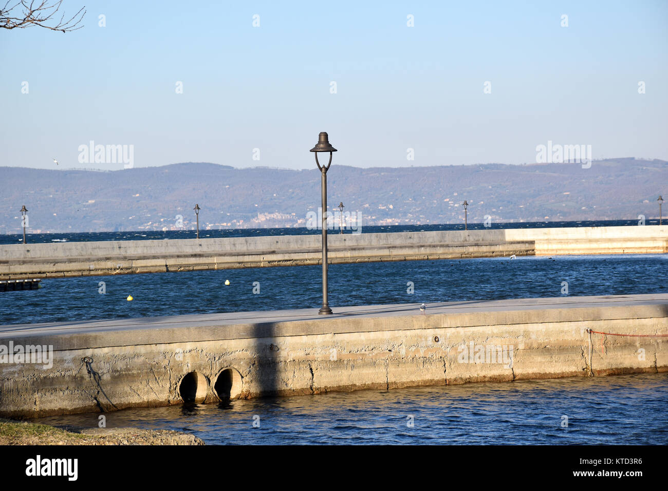 view of the marina with lighting pole Stock Photo - Alamy