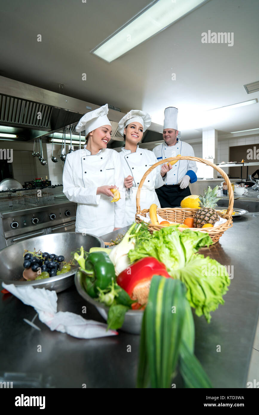 Girls having fun in the kitchen Stock Photo - Alamy