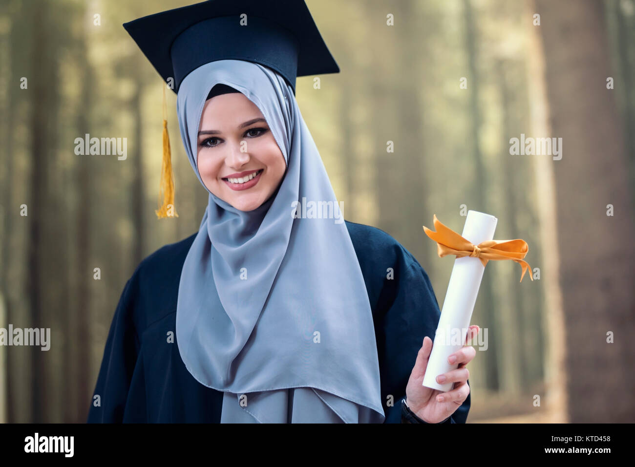graduation, pretty girl with hijab holding diploma, concept, success ...
