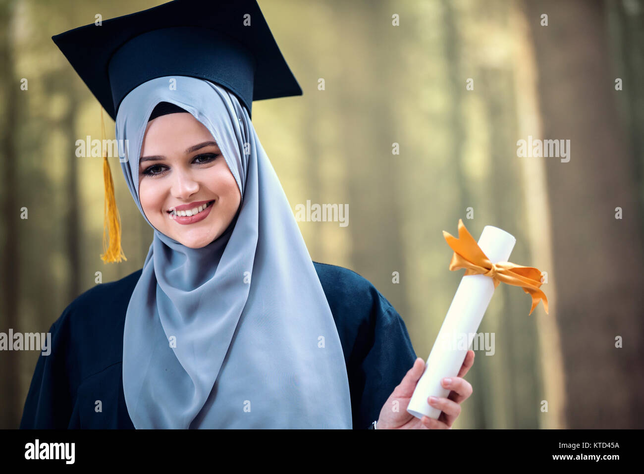 graduation, pretty girl with hijab holding diploma, concept, success ...