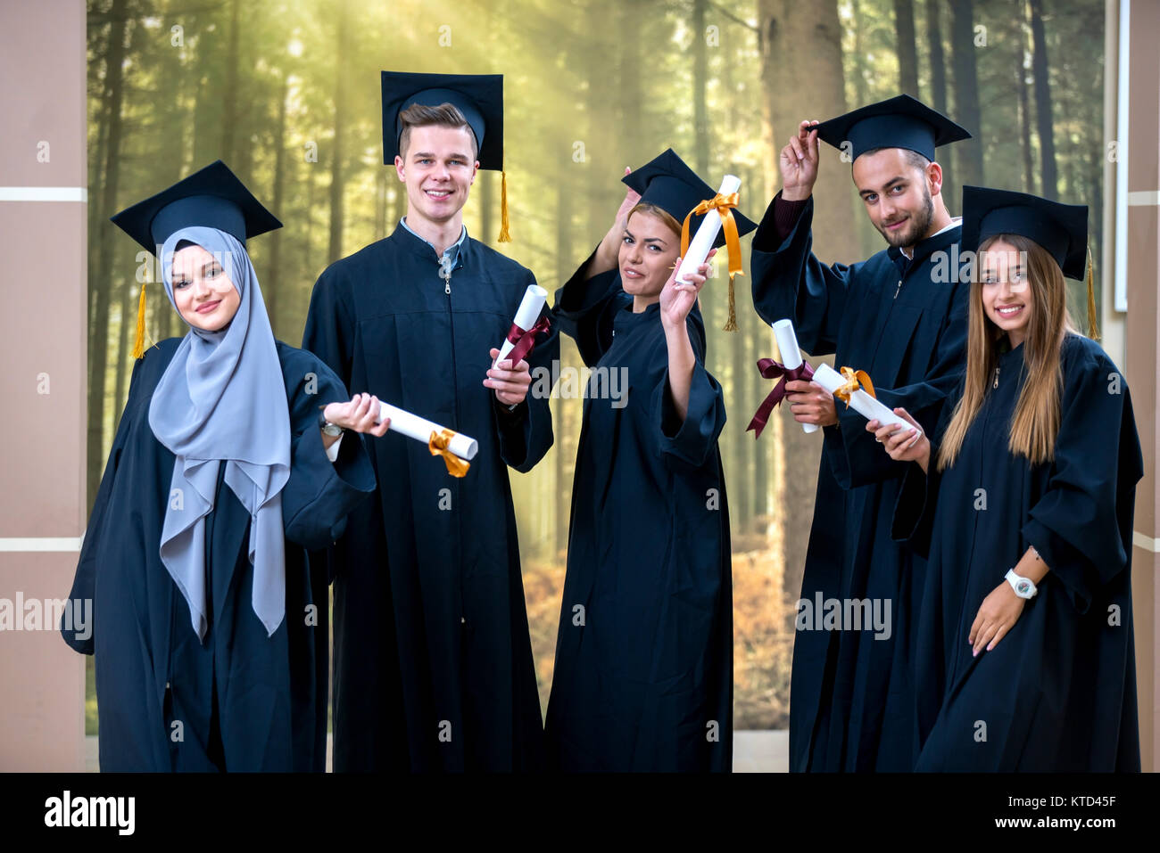 Group of Diverse International Graduating Students Celebrating, sitting ...