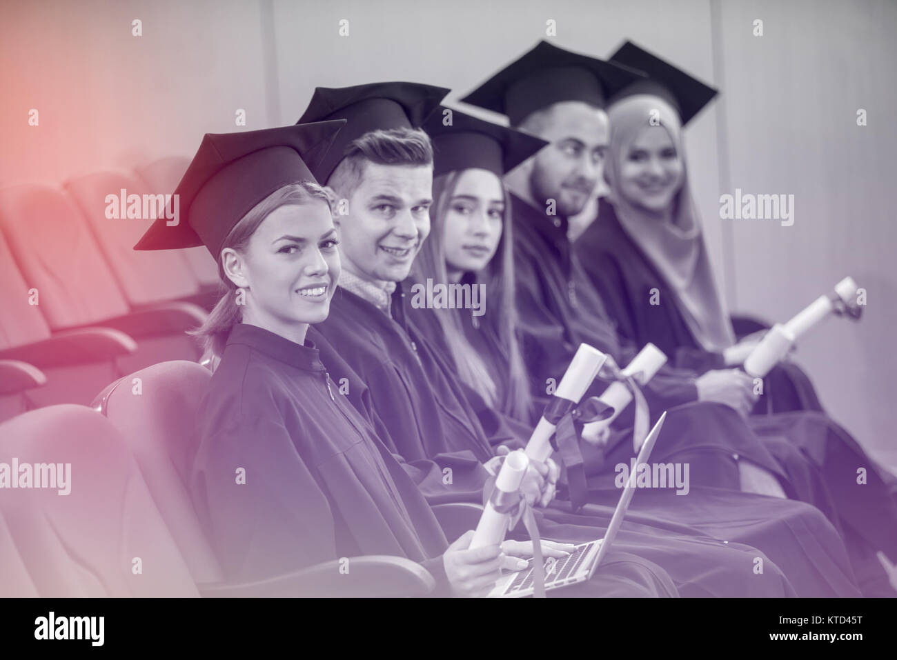 Group of Diverse International Graduating Students Celebrating, sitting ...