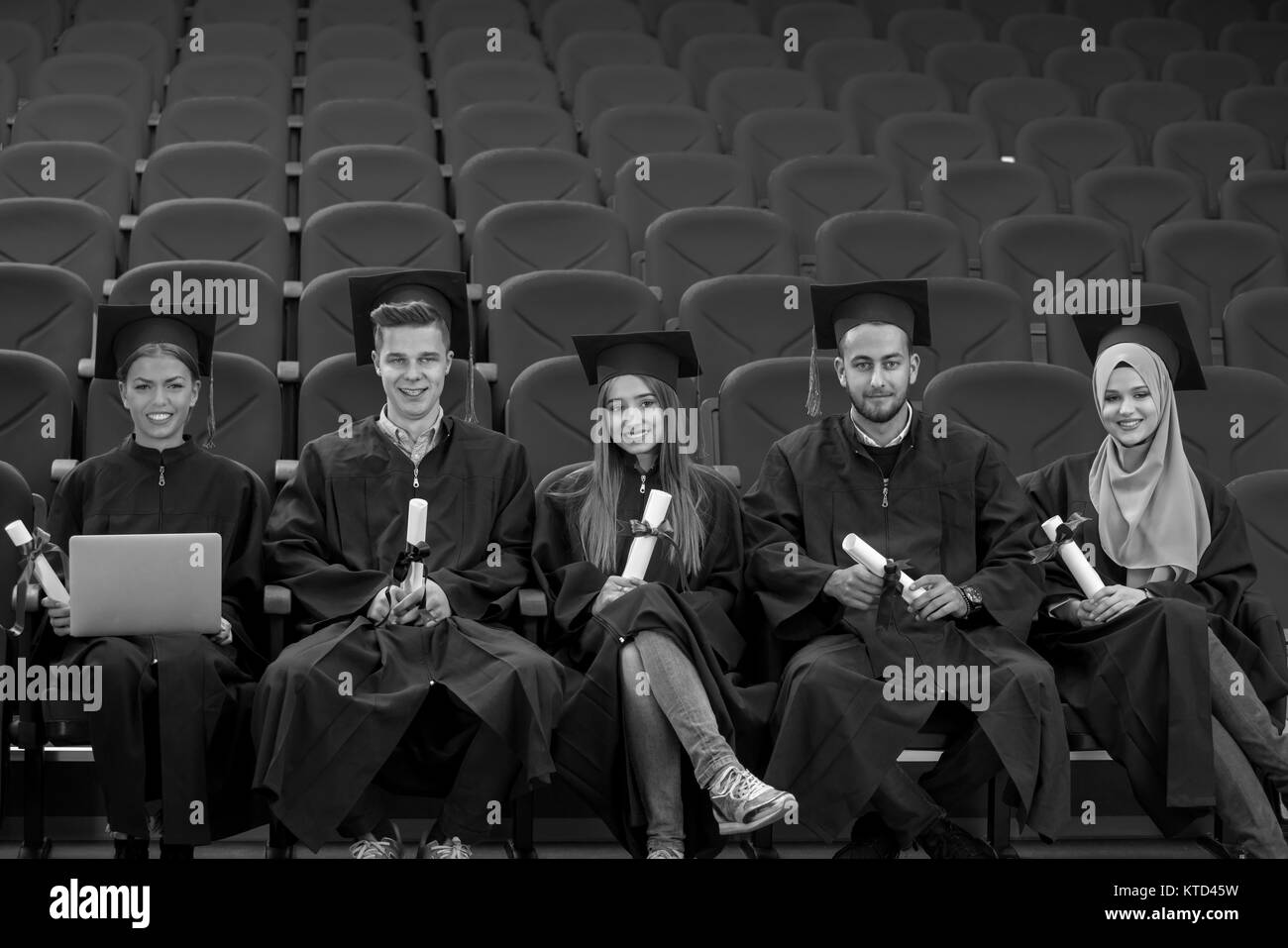 Group of Diverse International Graduating Students Celebrating, sitting ...
