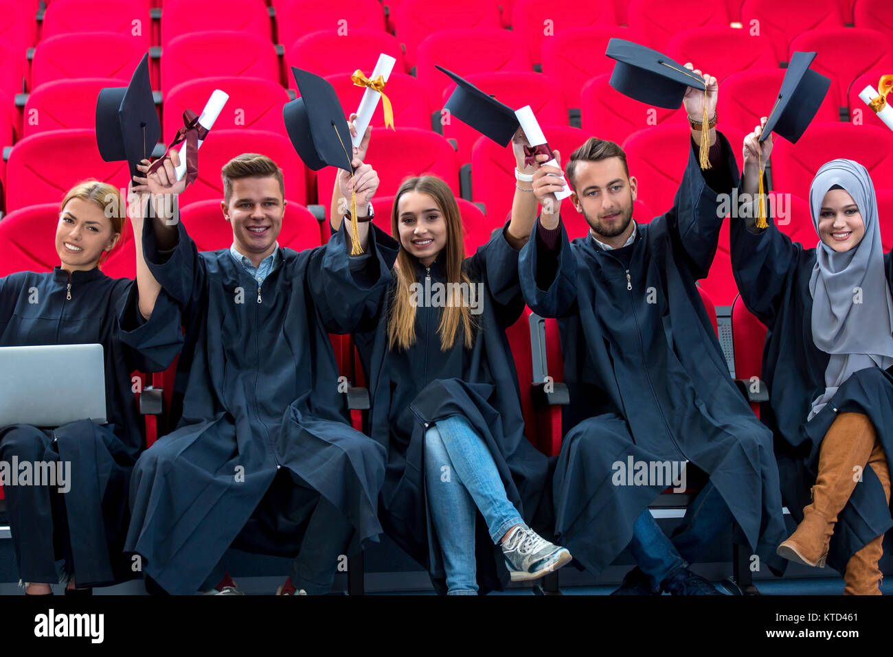 Group of Diverse International Graduating Students Celebrating, sitting ...