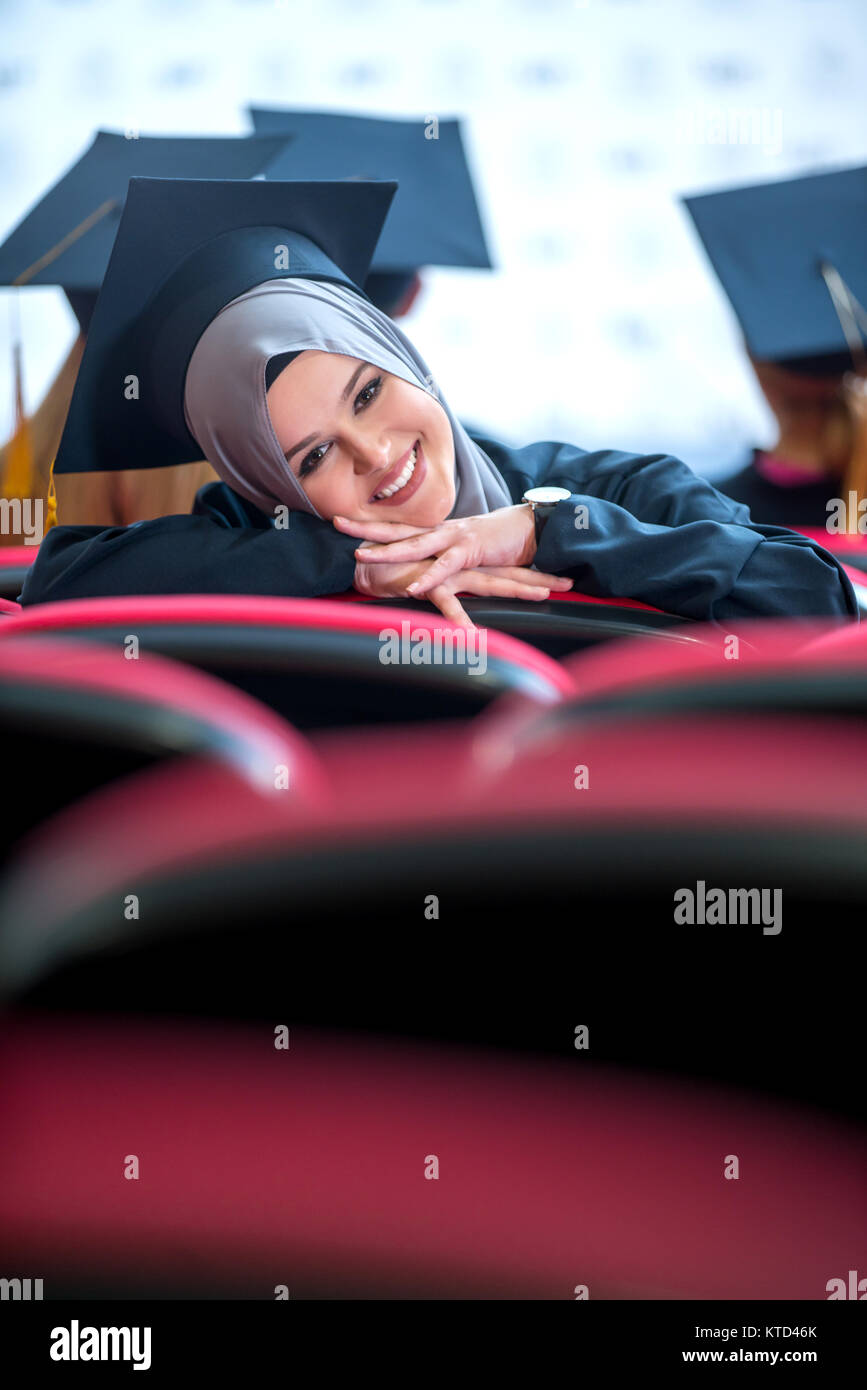 Group of Diverse International Graduating Students Celebrating, sitting ...