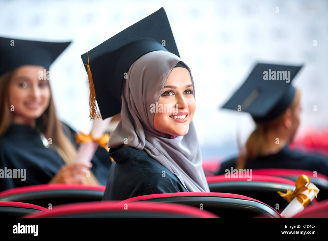 Group of Diverse International Graduating Students Celebrating, sitting ...