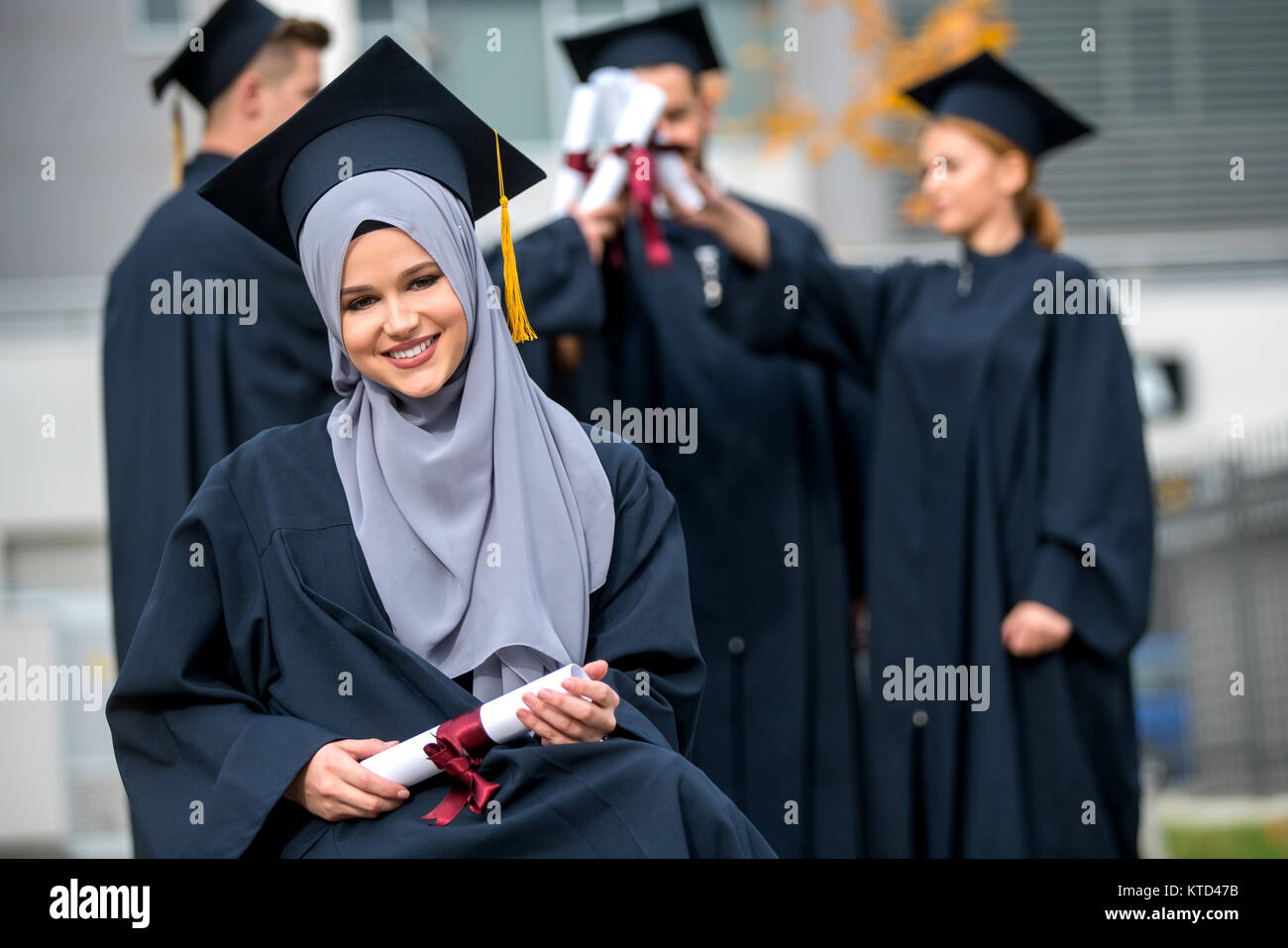 Group of Diverse International Graduating Students Celebrating, sitting ...