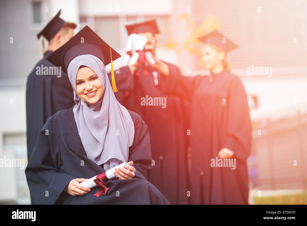 Group of Diverse International Graduating Students Celebrating, sitting ...