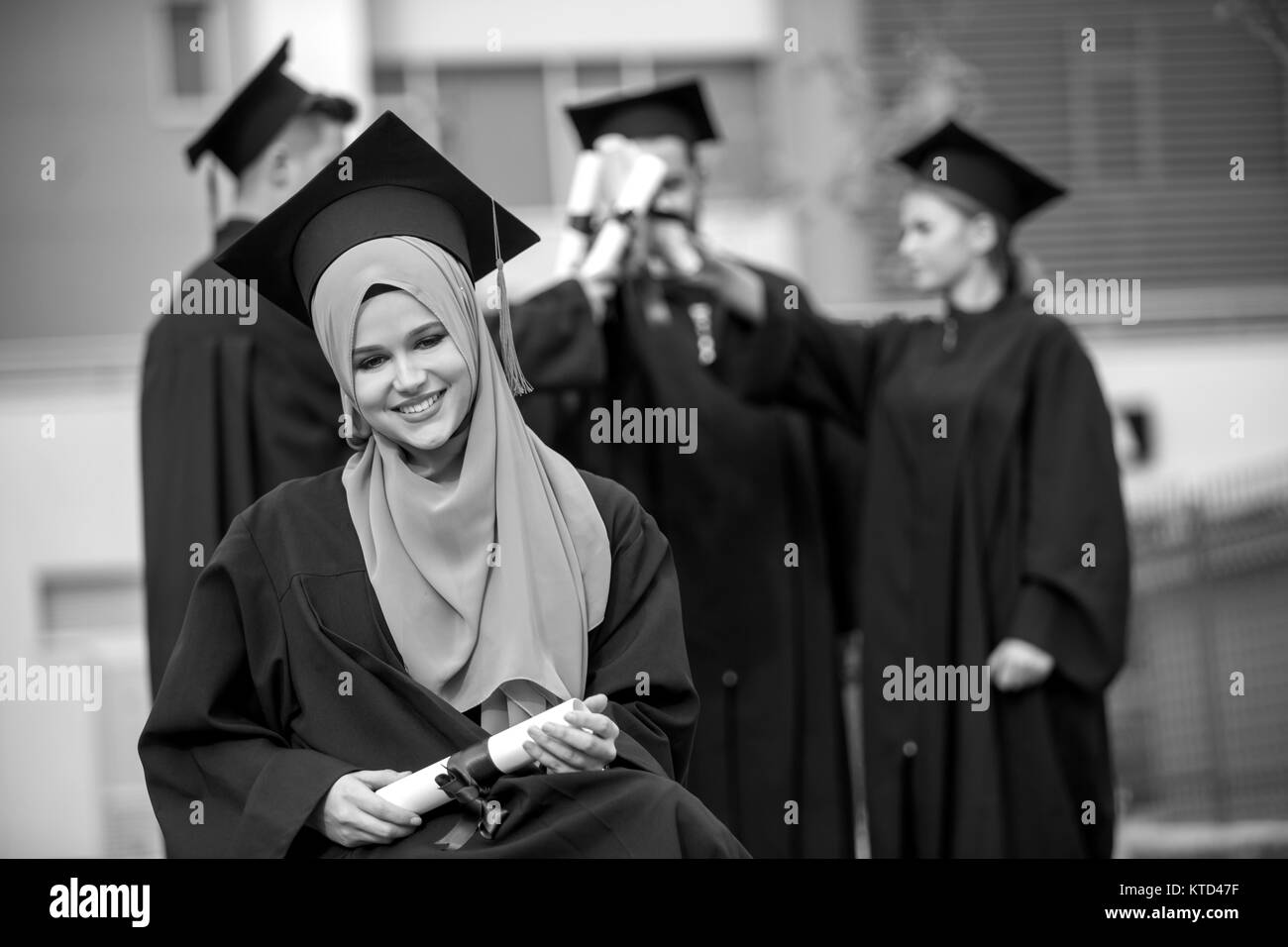 Group of Diverse International Graduating Students Celebrating, sitting ...