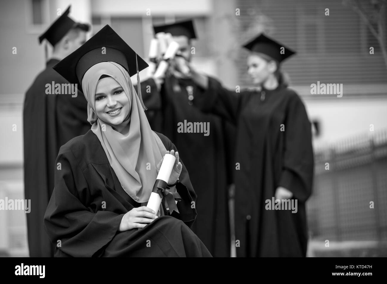 Group of Diverse International Graduating Students Celebrating, sitting ...