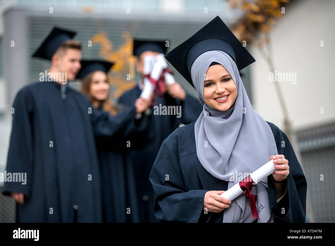 Group of Diverse International Graduating Students Celebrating, sitting ...