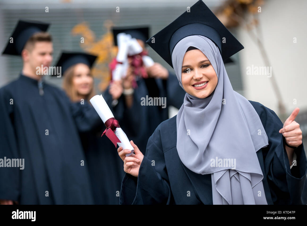 Group of Diverse International Graduating Students Celebrating, sitting ...
