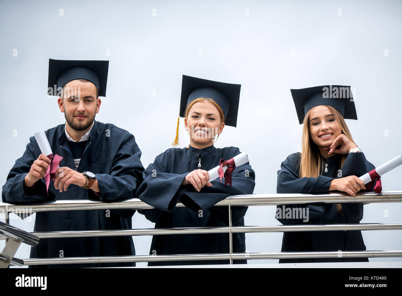 Group of Diverse International Graduating Students Celebrating, sitting ...