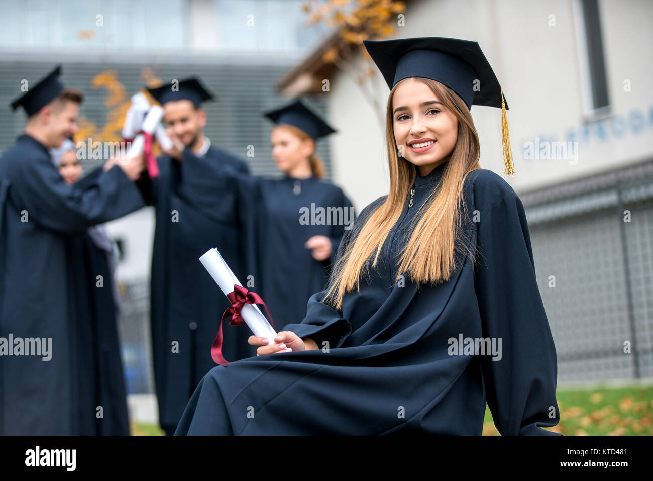 Group of Diverse International Graduating Students Celebrating, sitting ...