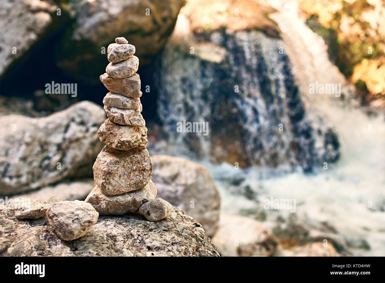 Zen-like pyramid of stones in perfect balance on the rocky mountains ...