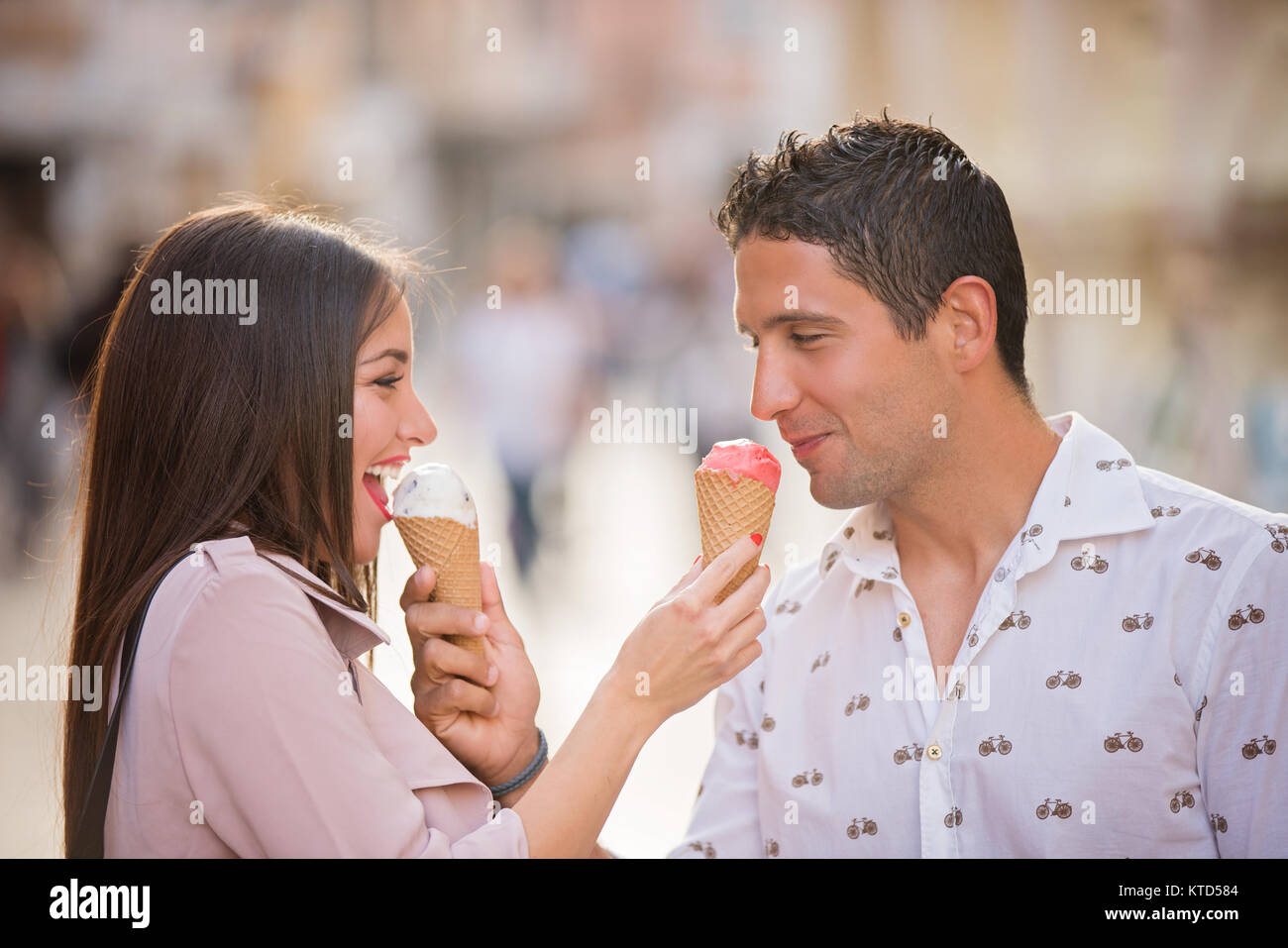 Multiracial couple eating icecream hi-res stock photography and images ...