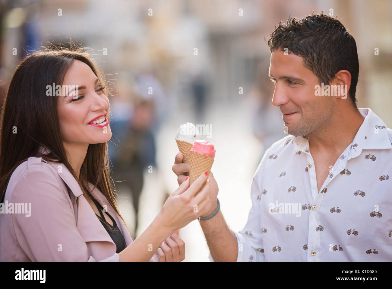 Multiracial couple eating icecream hi-res stock photography and images ...