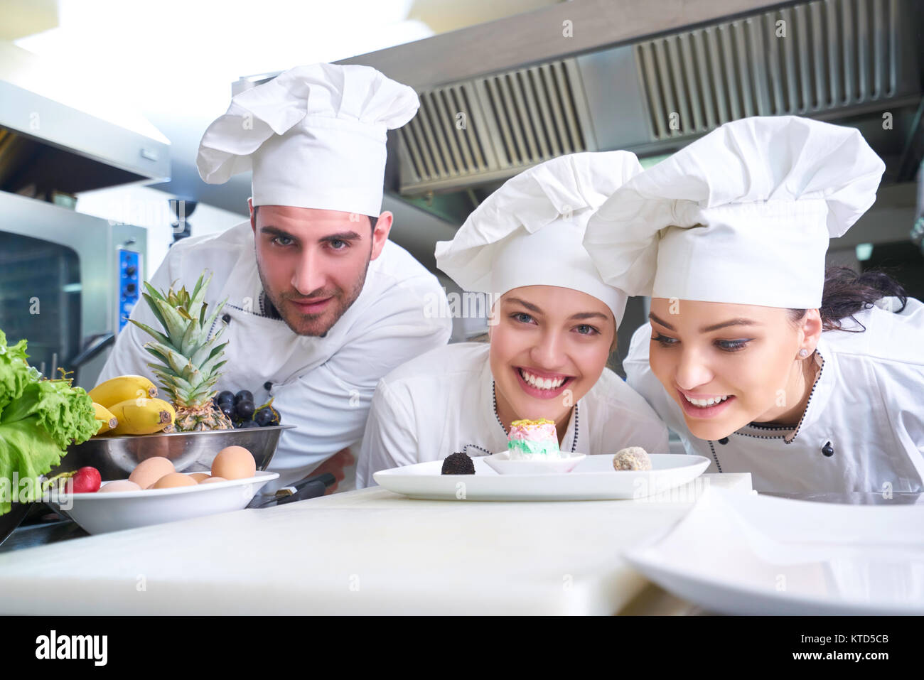 Chef preparing food in restaurant kitchen Stock Photo - Alamy