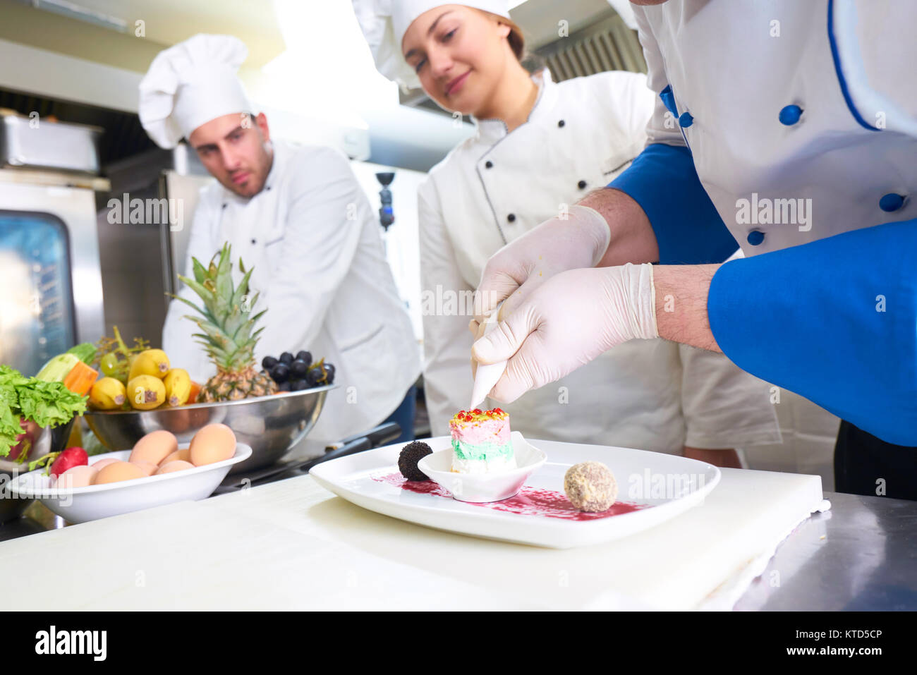 Chef preparing food in restaurant kitchen Stock Photo - Alamy