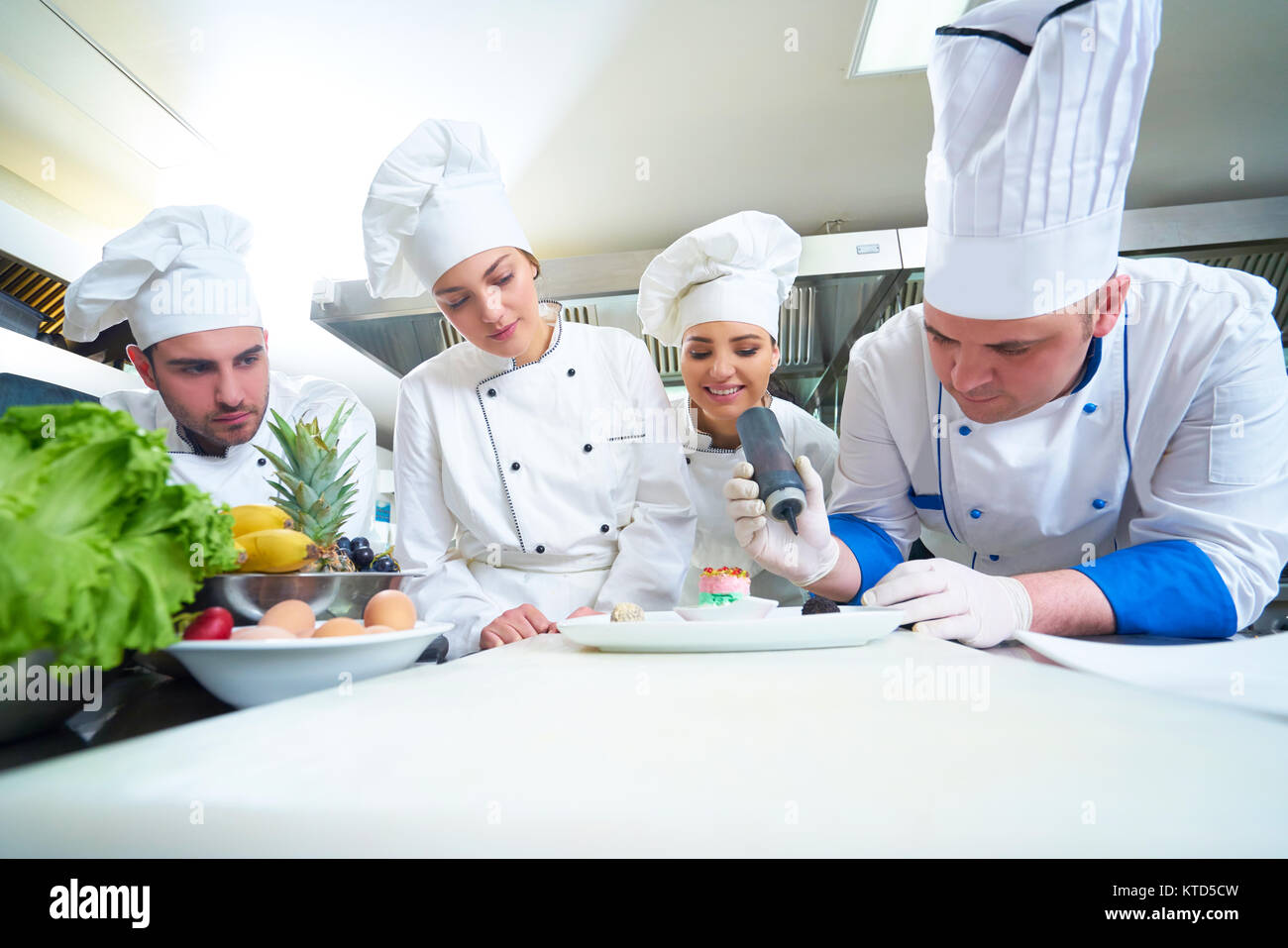 Chef preparing food in restaurant kitchen Stock Photo - Alamy