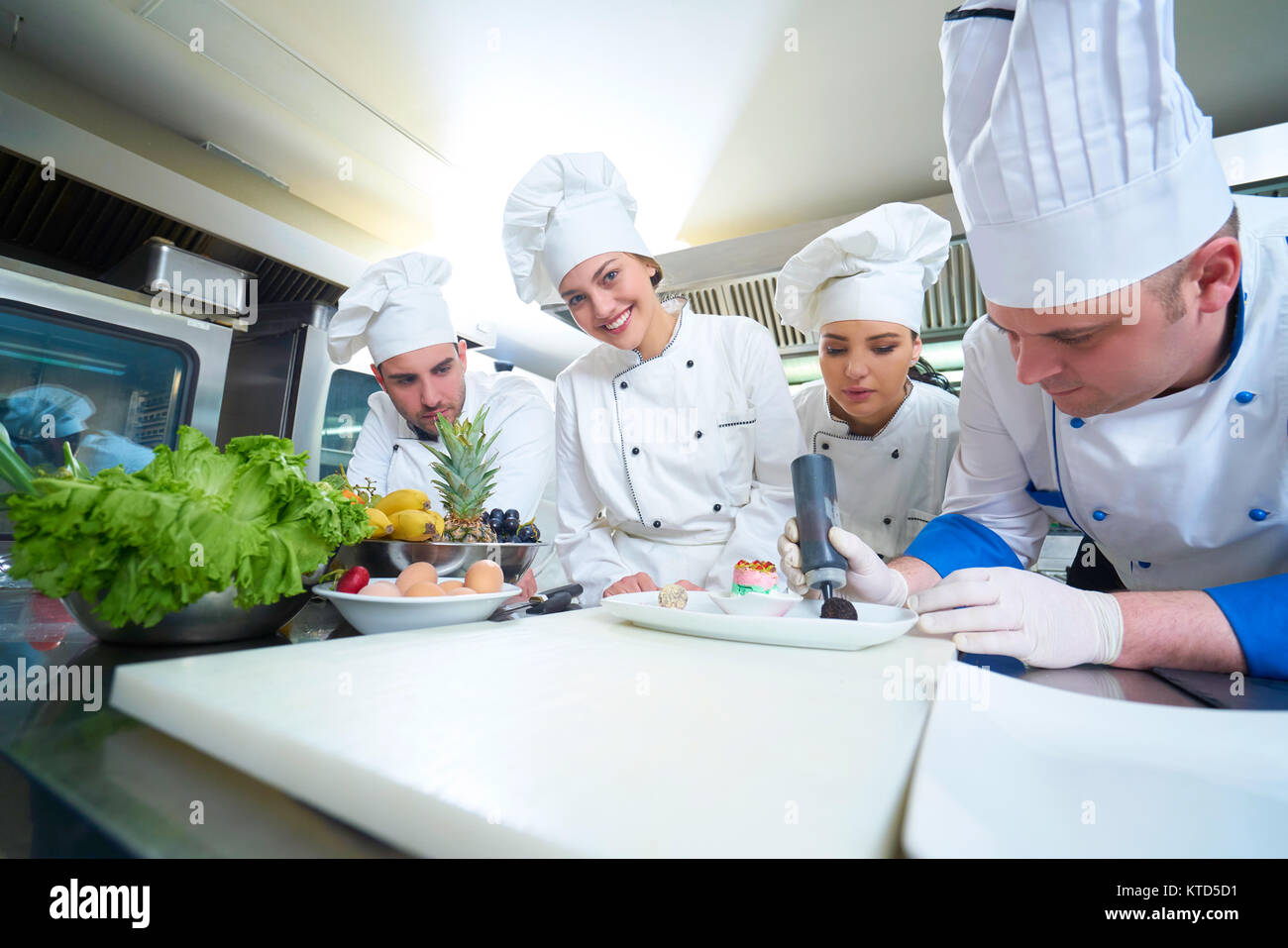Chef preparing food in restaurant kitchen Stock Photo - Alamy