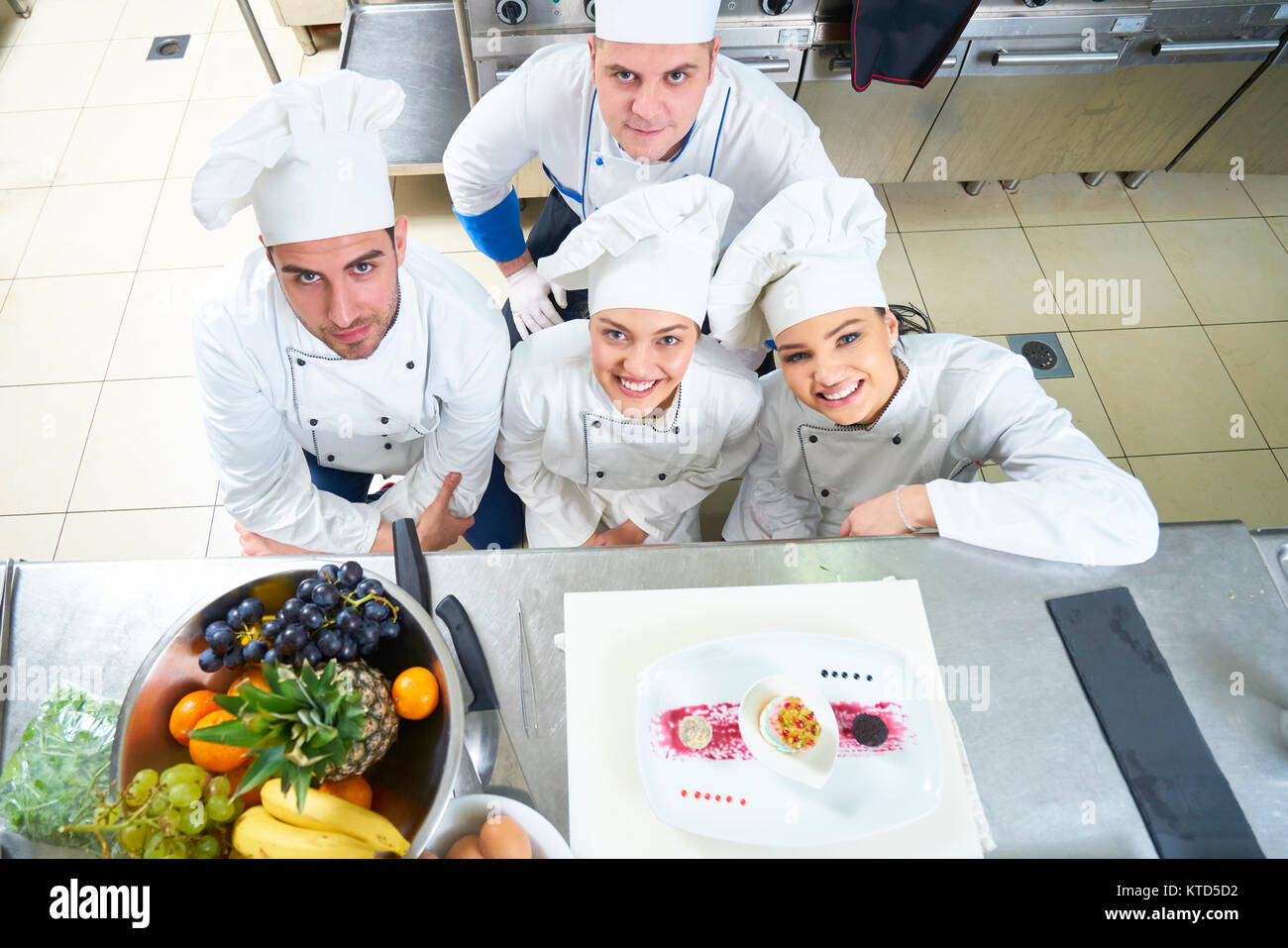 Chef preparing food in restaurant kitchen Stock Photo - Alamy