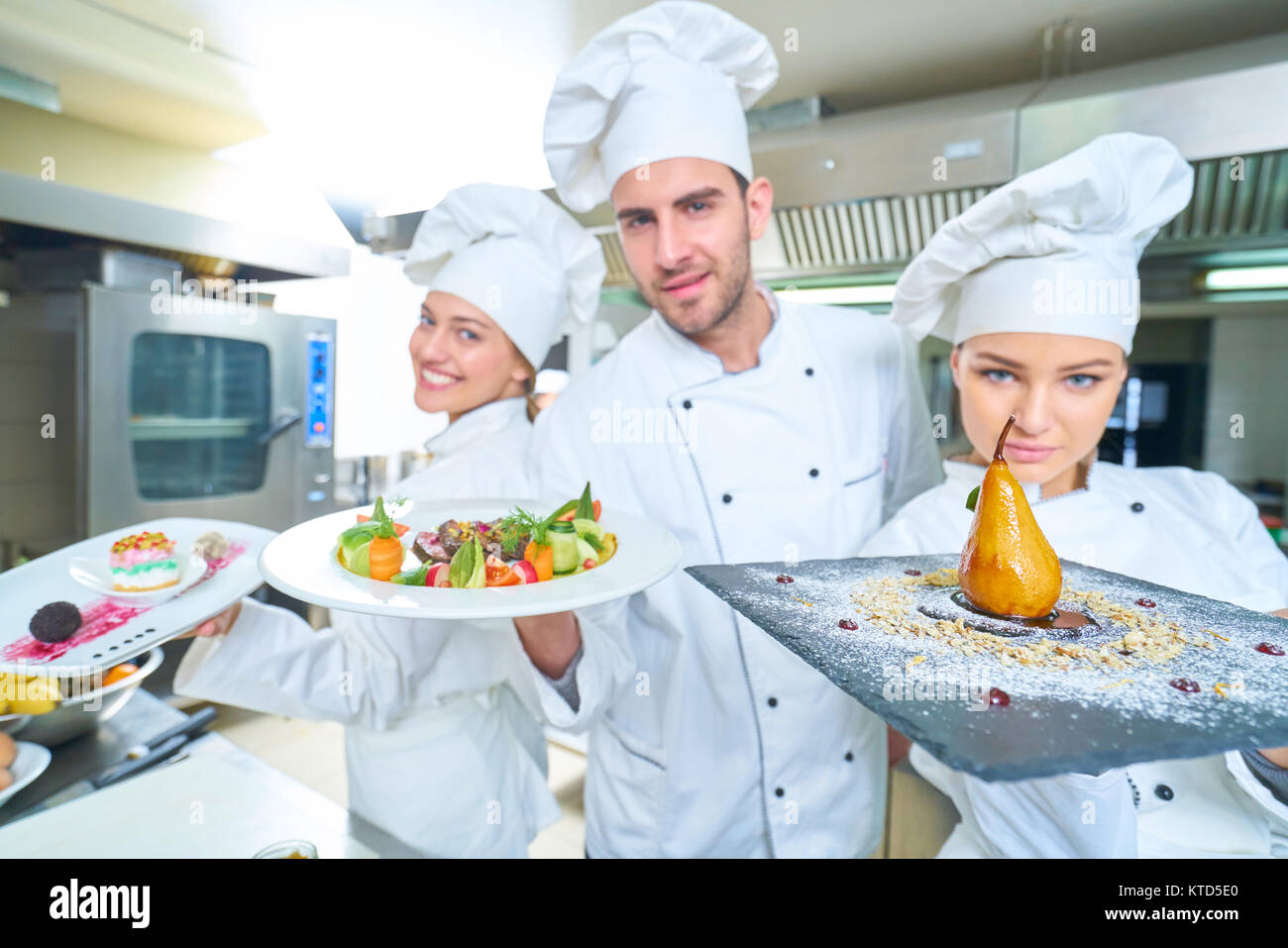 Chef preparing food in restaurant kitchen Stock Photo - Alamy