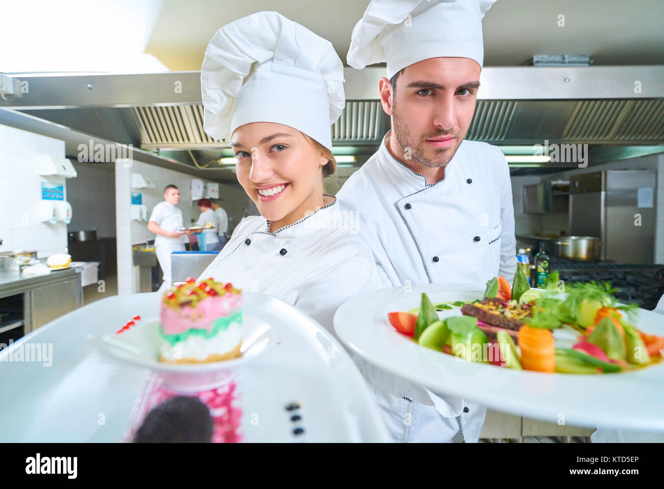 Chef preparing food in restaurant kitchen Stock Photo - Alamy