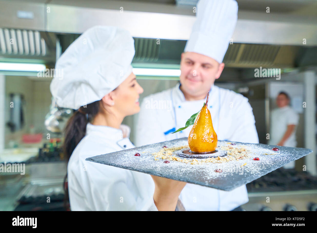 Chef preparing food in restaurant kitchen Stock Photo - Alamy