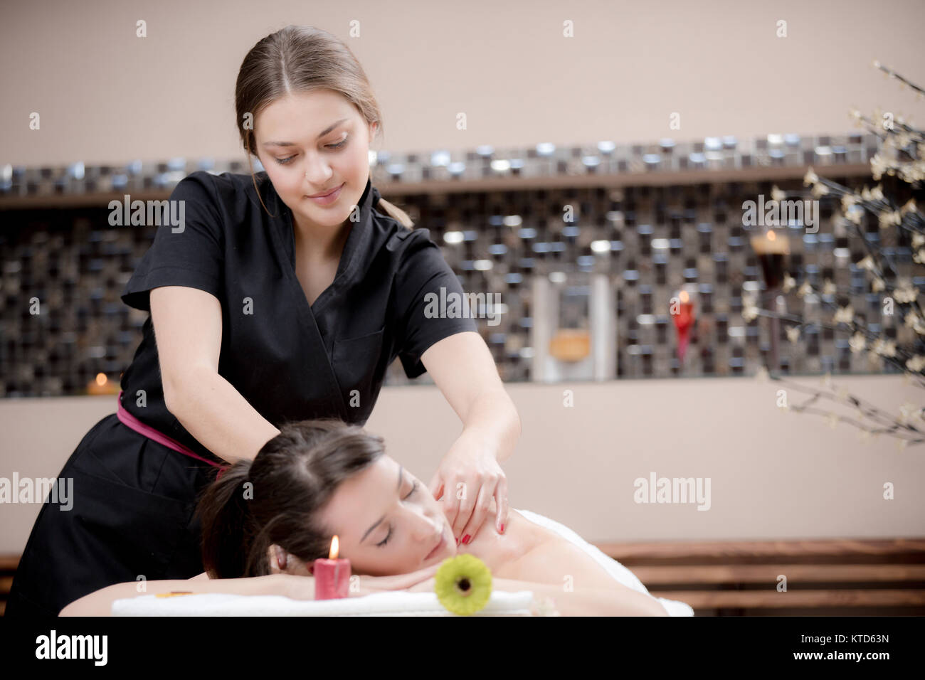 Spa woman. Female enjoying relaxing back massage in cosmetology spa ...